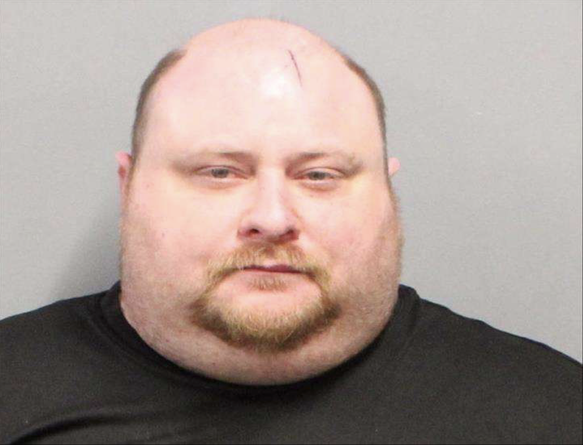 Suspected drunk driver charged after driving into trees, spitting on ...