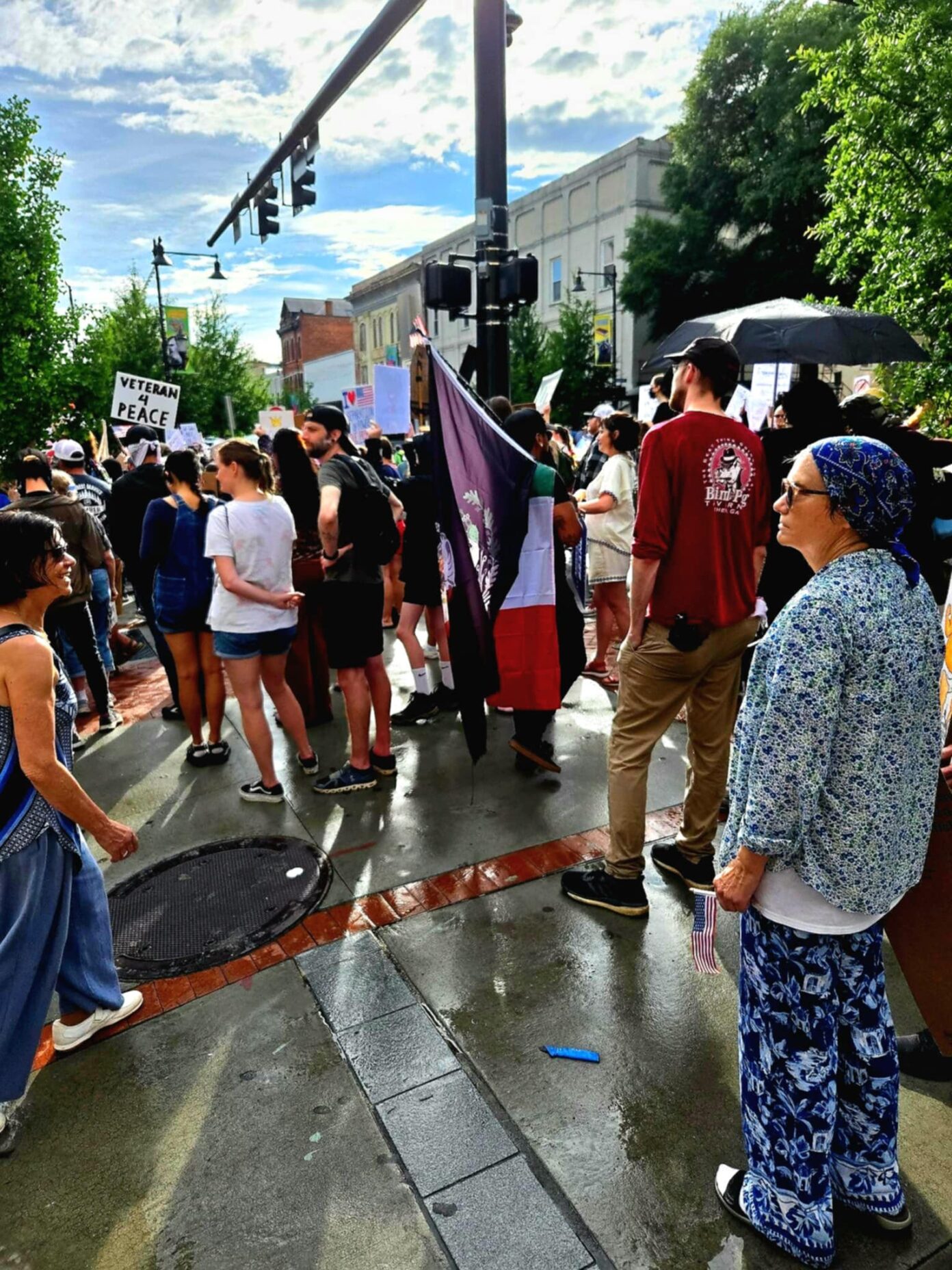 Defiant and drenched: Hundreds gather in Athens for anti-Trump ‘No ...
