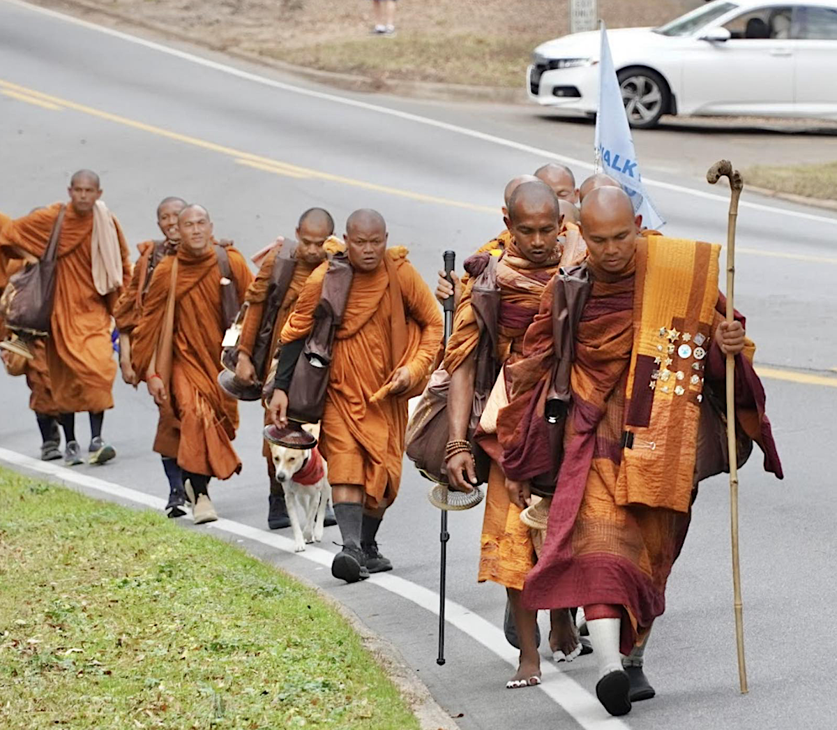 Buddhist monks persist in peace walk despite injuries as thousands ...